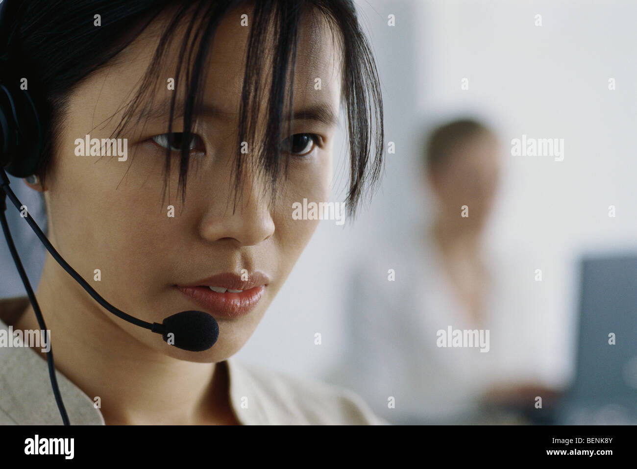 Customer service representative wearing headset Stock Photo - Alamy