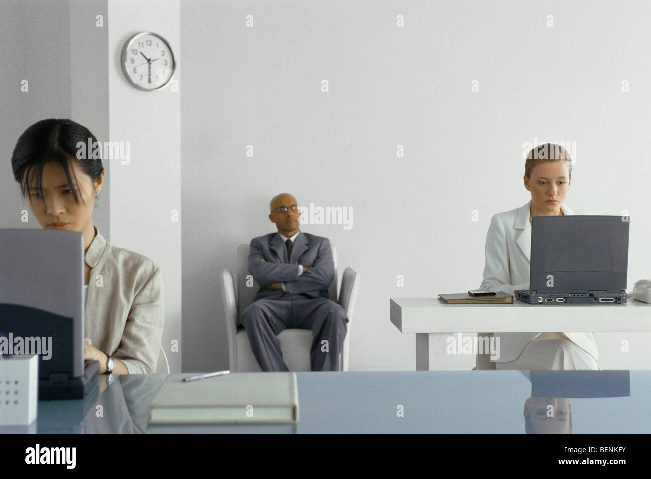 Manager supervising office workers Stock Photo - Alamy