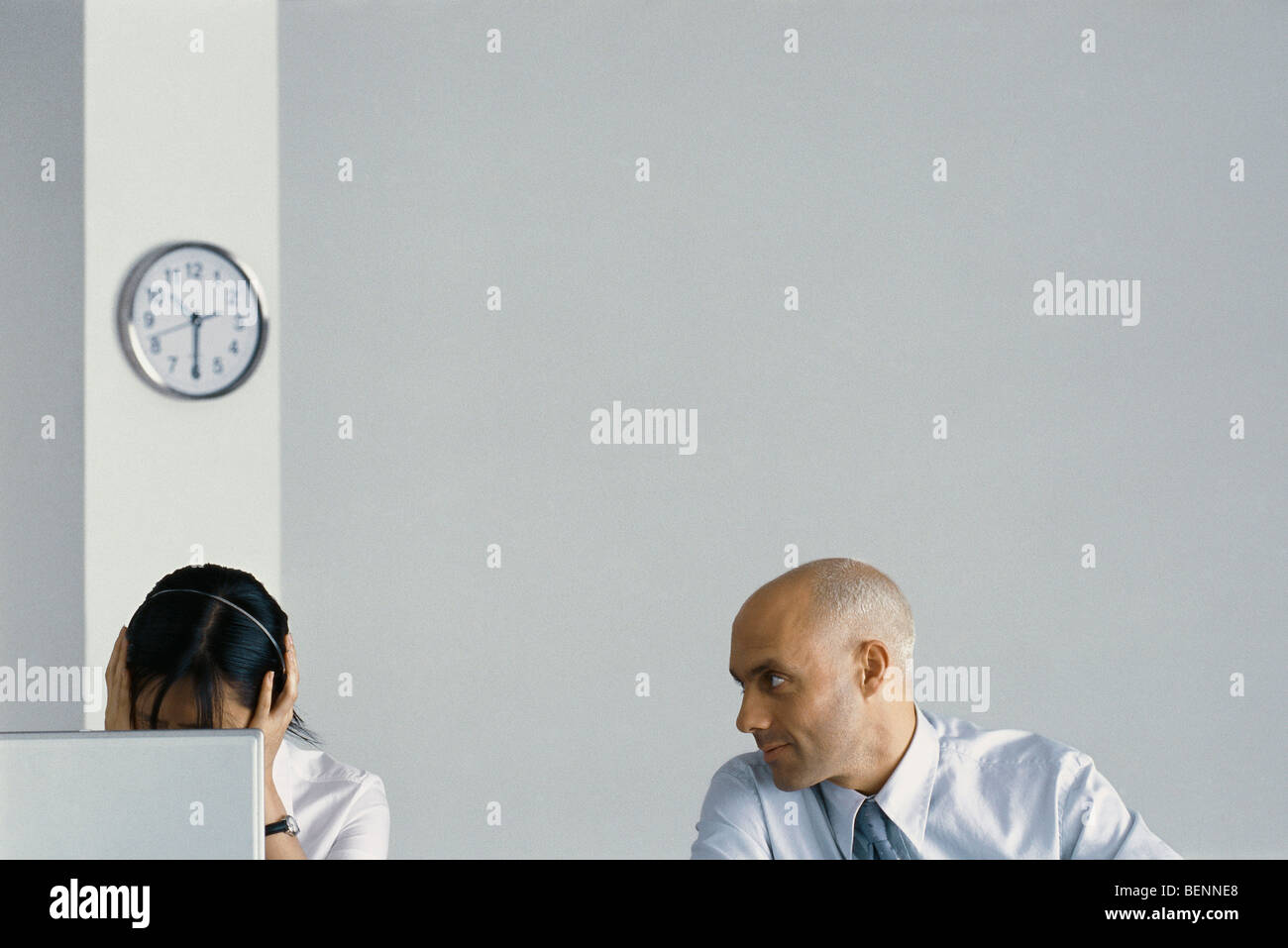 Office worker bothering female colleague Stock Photo - Alamy