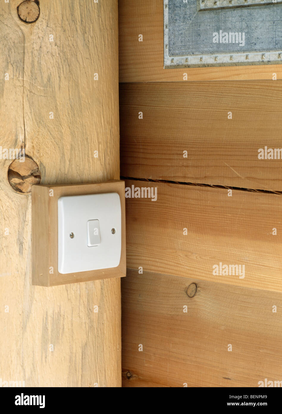 Close-up of electric light switch on vertical wooden beam Stock Photo ...