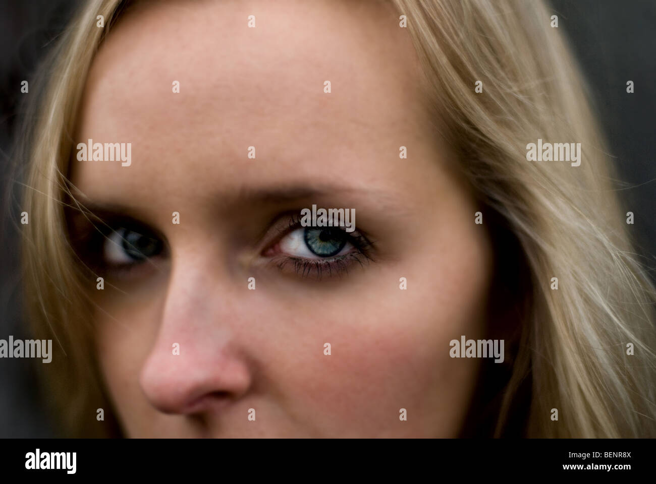 The intense stare of a young woman with blond hair. Photo by Gordon ...