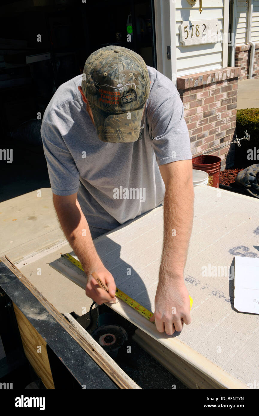 Carpenter uses tape measure calculate hi-res stock photography and ...