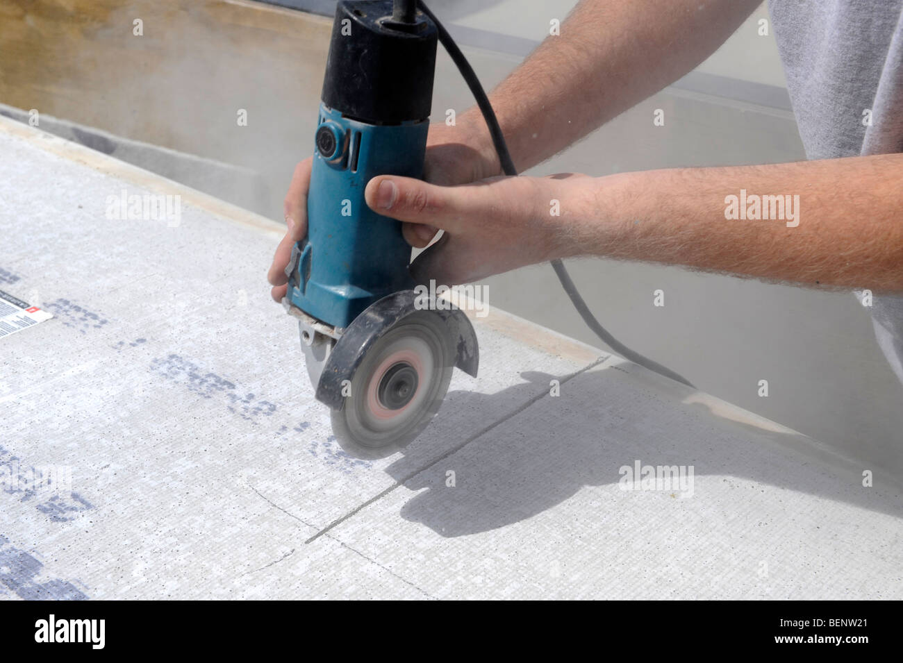 Carpenter using power cutting tool in construction project Stock Photo ...