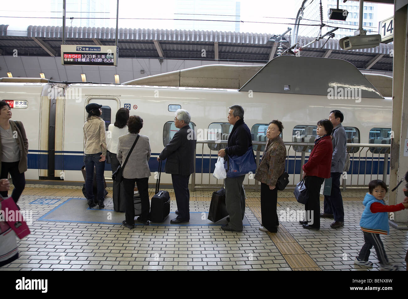 JAPAN Shinkansen (Bullet) train, Tokyo. Passengers waiting. photo by Sean Spraqgue 2008 Stock ...
