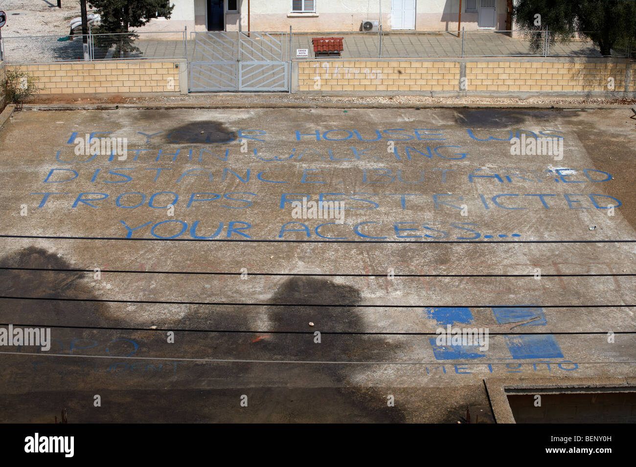 protest slogan painted in the UN buffer zone in the green line dividing ...