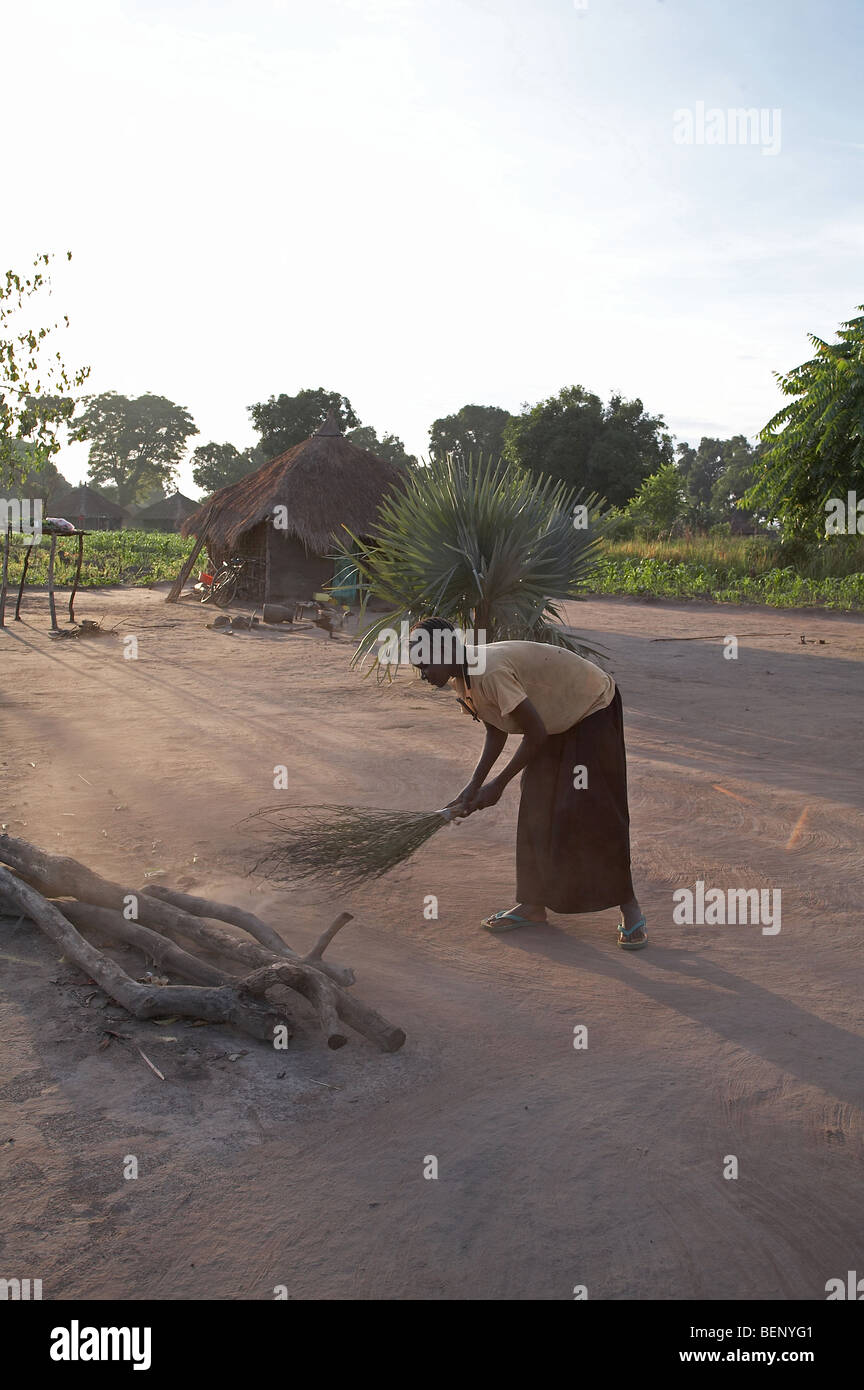 Woman sweeping africa hi-res stock photography and images - Alamy