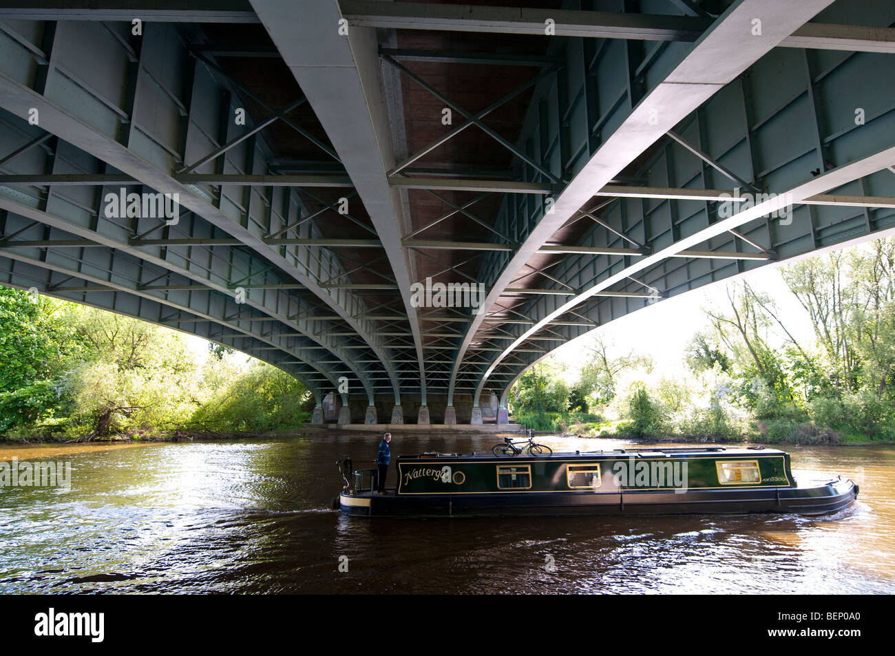 A narrow boat passes under the M4 Thames Bridge at Maidenhead Stock ...