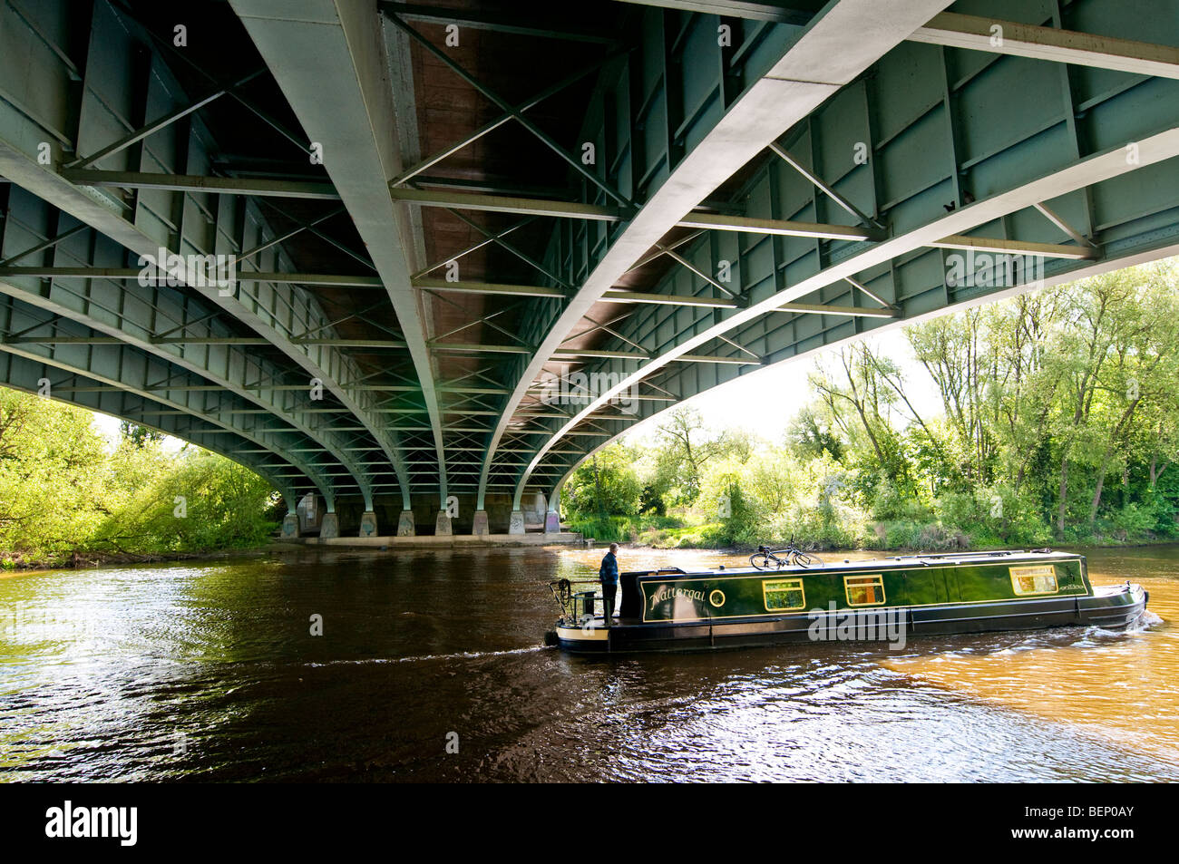 A narrow boat passes under the M4 Thames Bridge at Maidenhead Stock ...