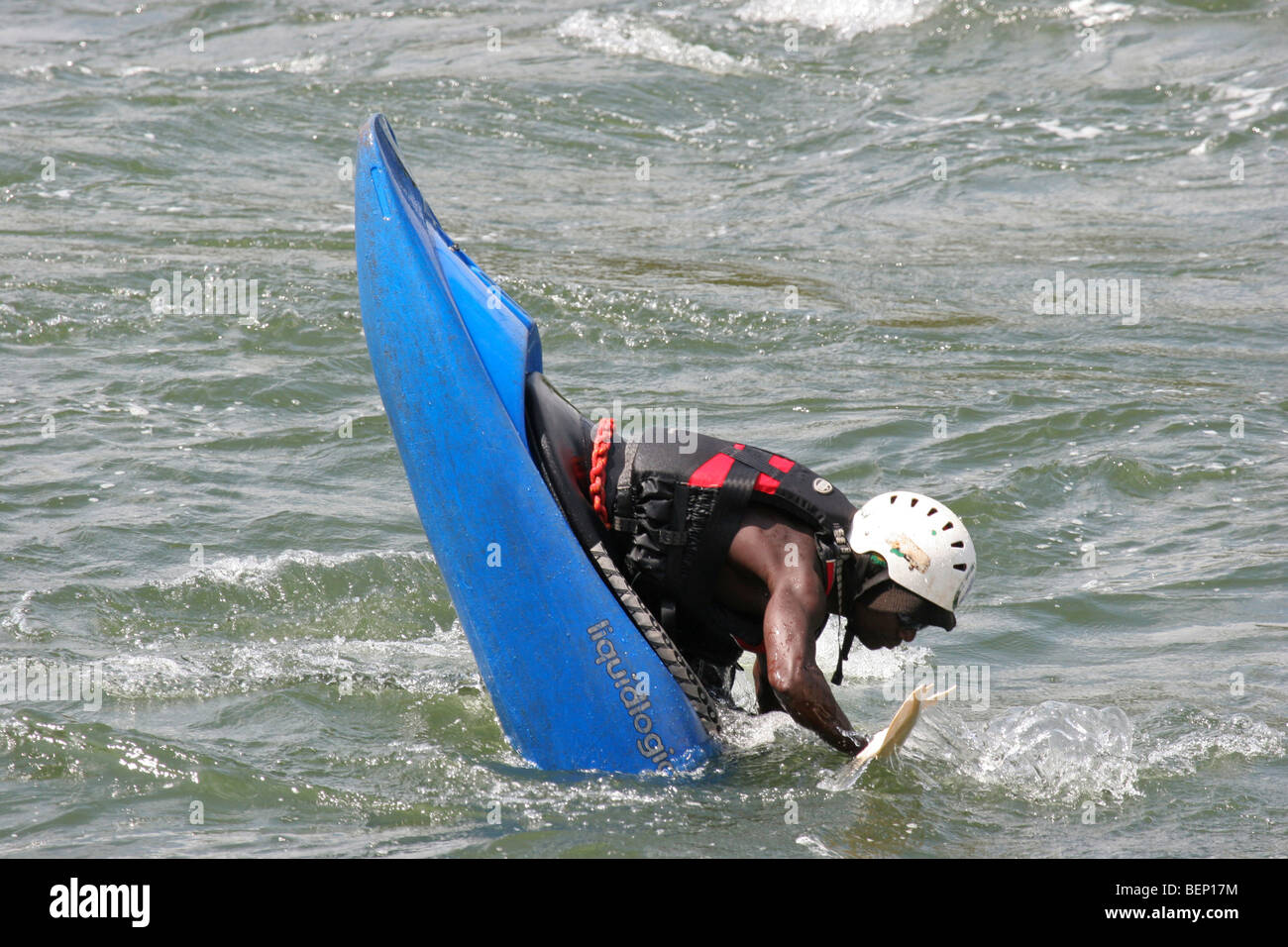 Kayaker in kayak on the river White Nile / Victoria Nile, Uganda ...