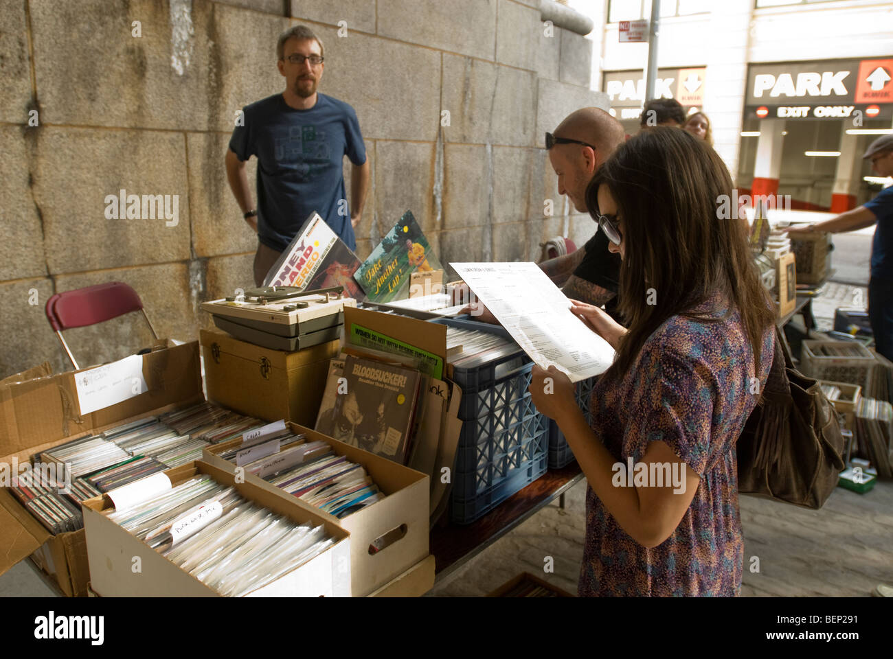 Music lovers sort through stacks and stacks of vinyl records at the DJ ...