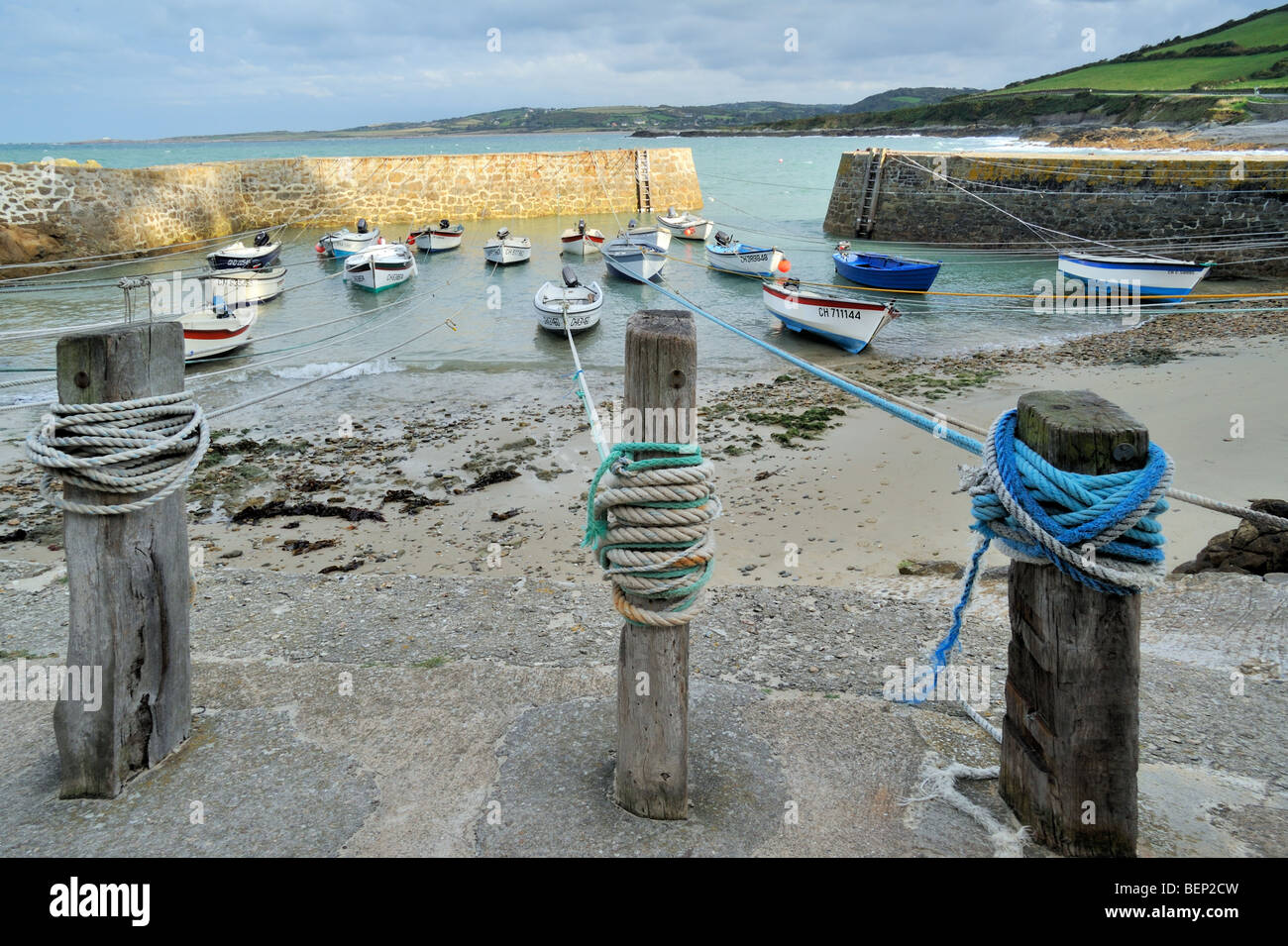 Ropes knotted around wooden mooring posts at Port Racine, the smallest ...