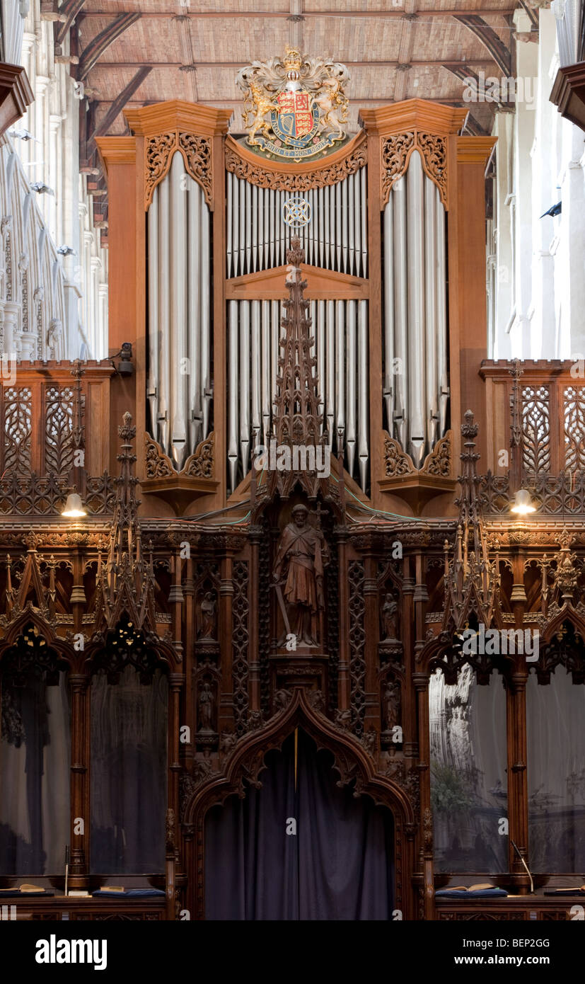 Ornately carved wood leading to the curtained entrance to the organ at ...
