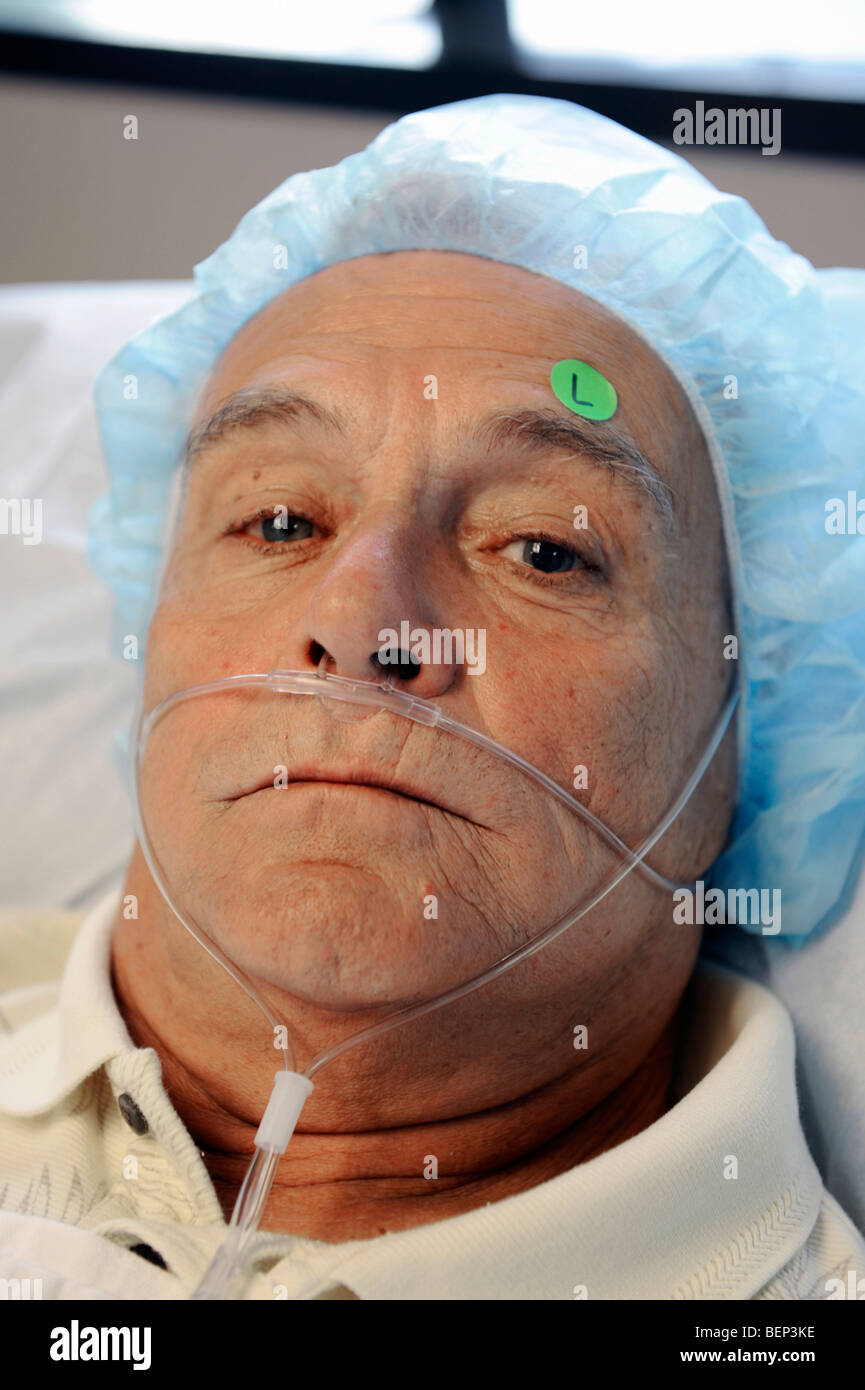 Adult male is prepare and undergoes a crystalens eye implant for ...