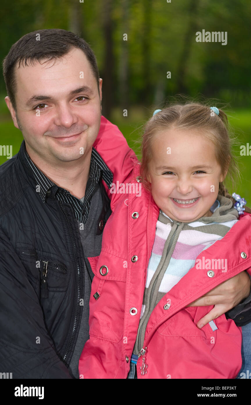 Family portrait: father and his little child on hands Stock Photo - Alamy