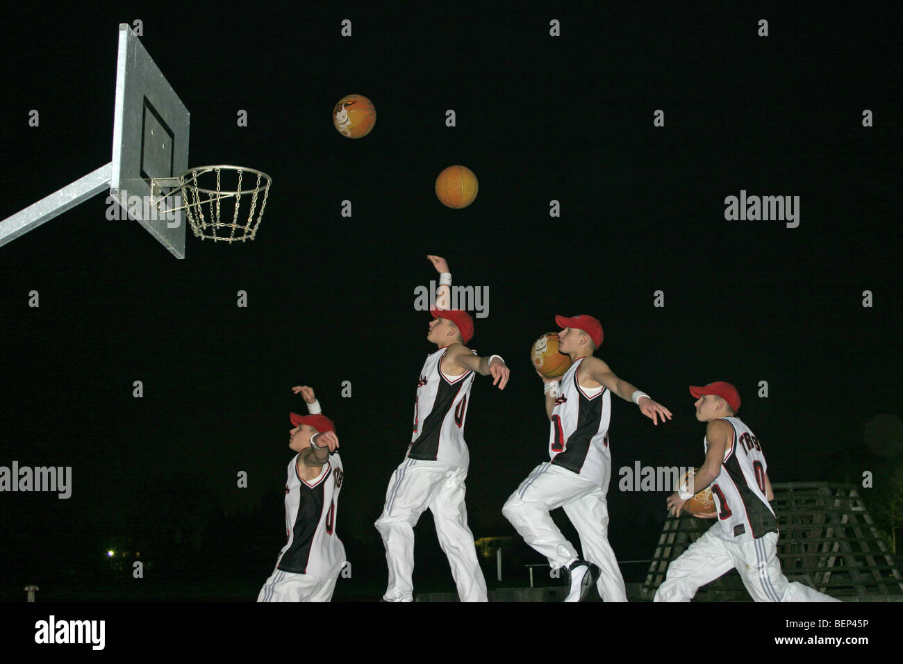 motion sequence of a basketball player throwing the ball into the ...
