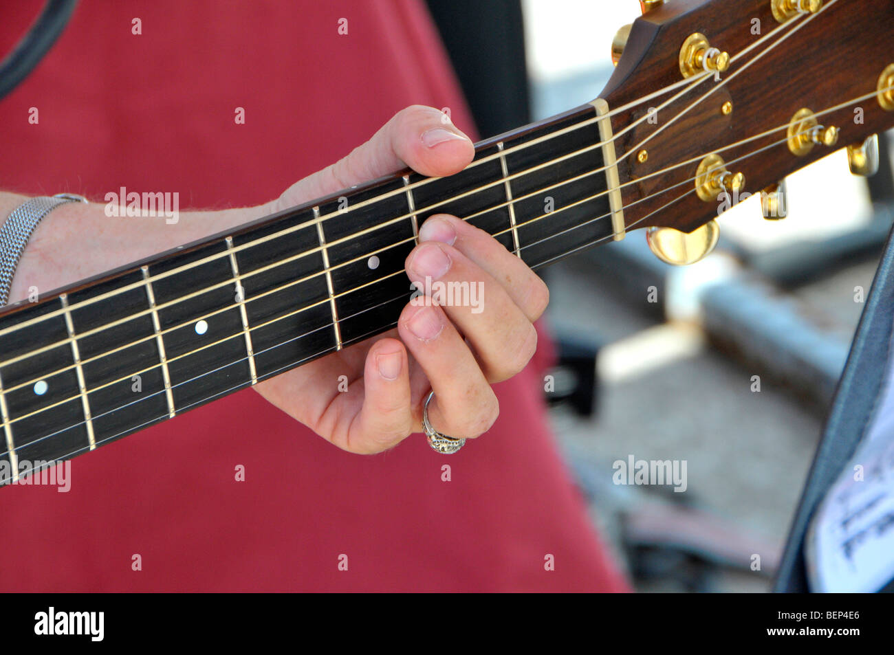 Hand playing a string guitar Stock Photo - Alamy
