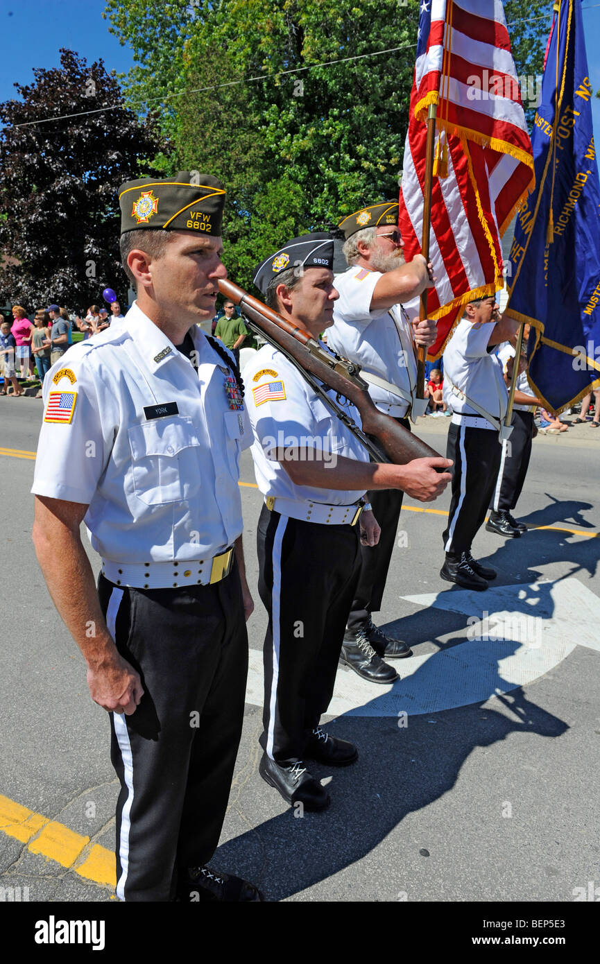 Uniformed Veterans Marching in Parade Honor Guard with Flags Stock ...