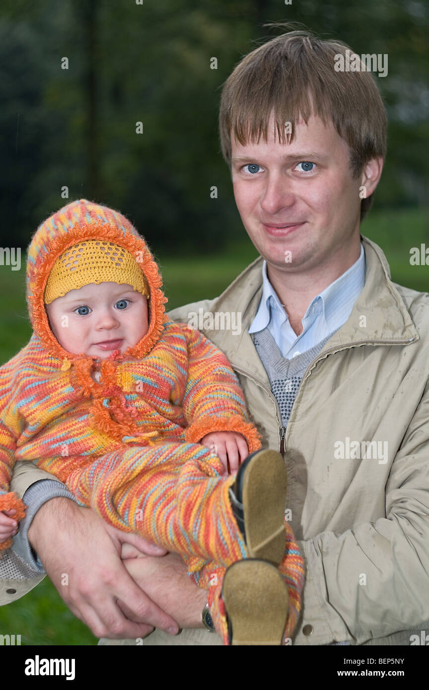 Family portrait: father and his little child on hands Stock Photo - Alamy
