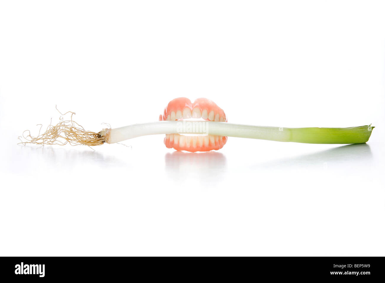 Keep a fresh breath and eat a spring onion Stock Photo - Alamy