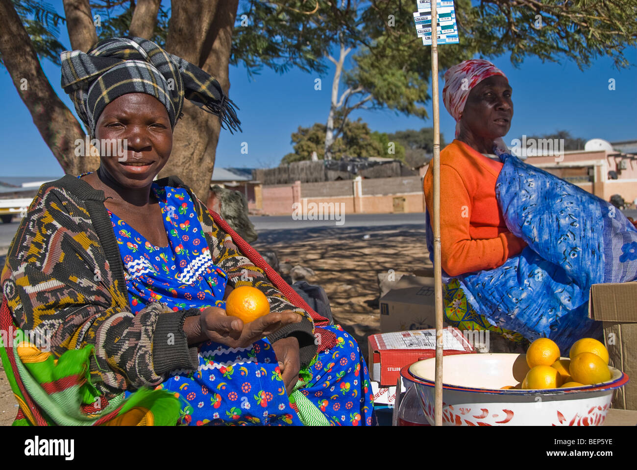 African womenin a street market selling goods. Village of Rundu ...