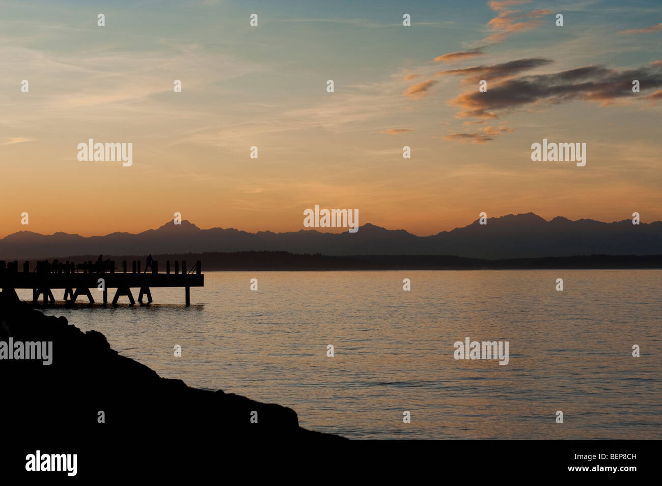 On Alki Beach in West Seattle, Washington, the sun sets over the ...