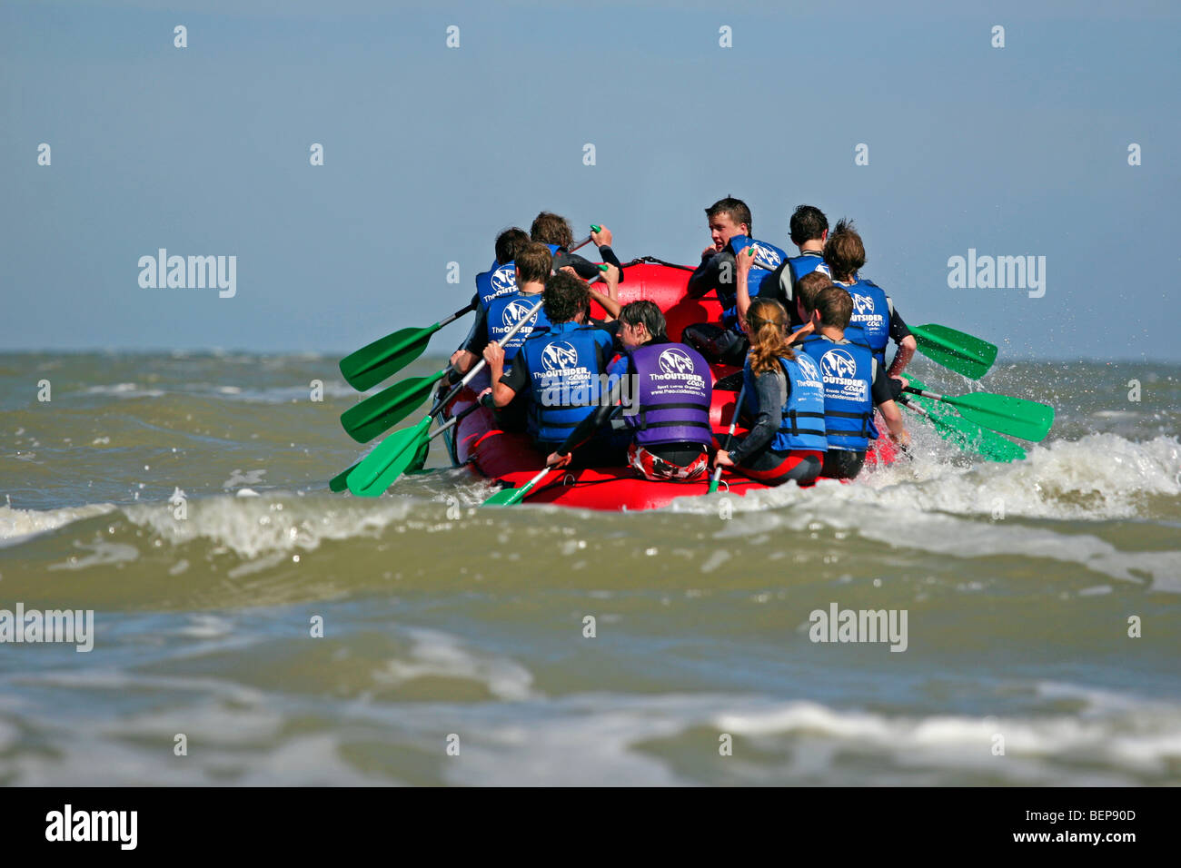 Young men rafting with inflatable boat on the North Sea Stock Photo - Alamy