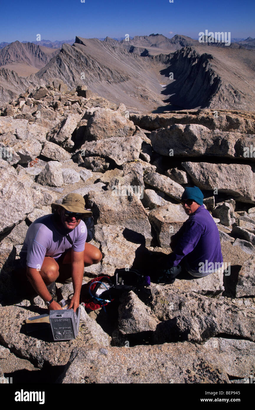 Men opening register box on Mt.Barnard Stock Photo - Alamy