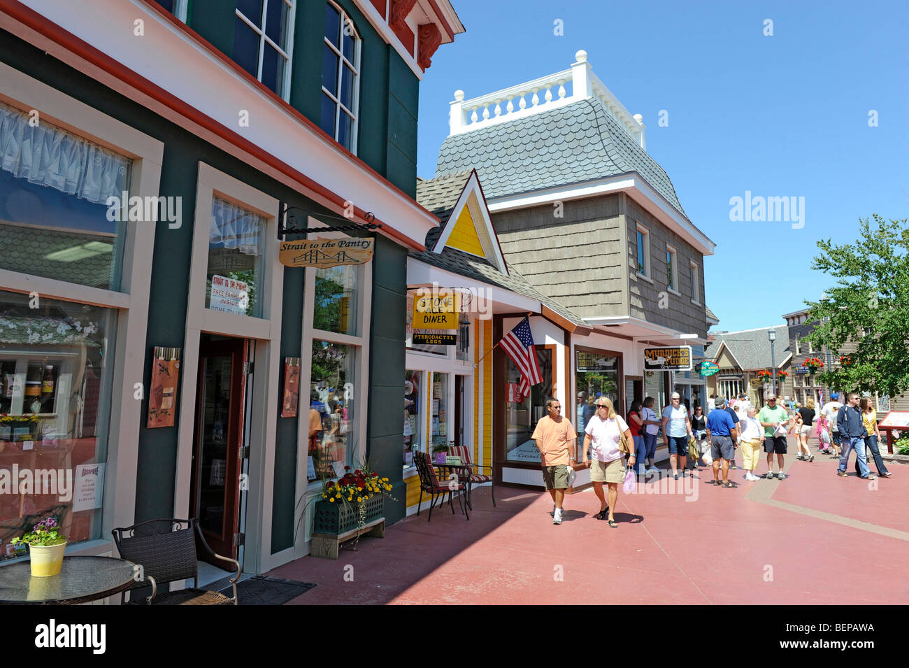 Customers walk around stores and shops in Mackinaw Crossings Shopping ...