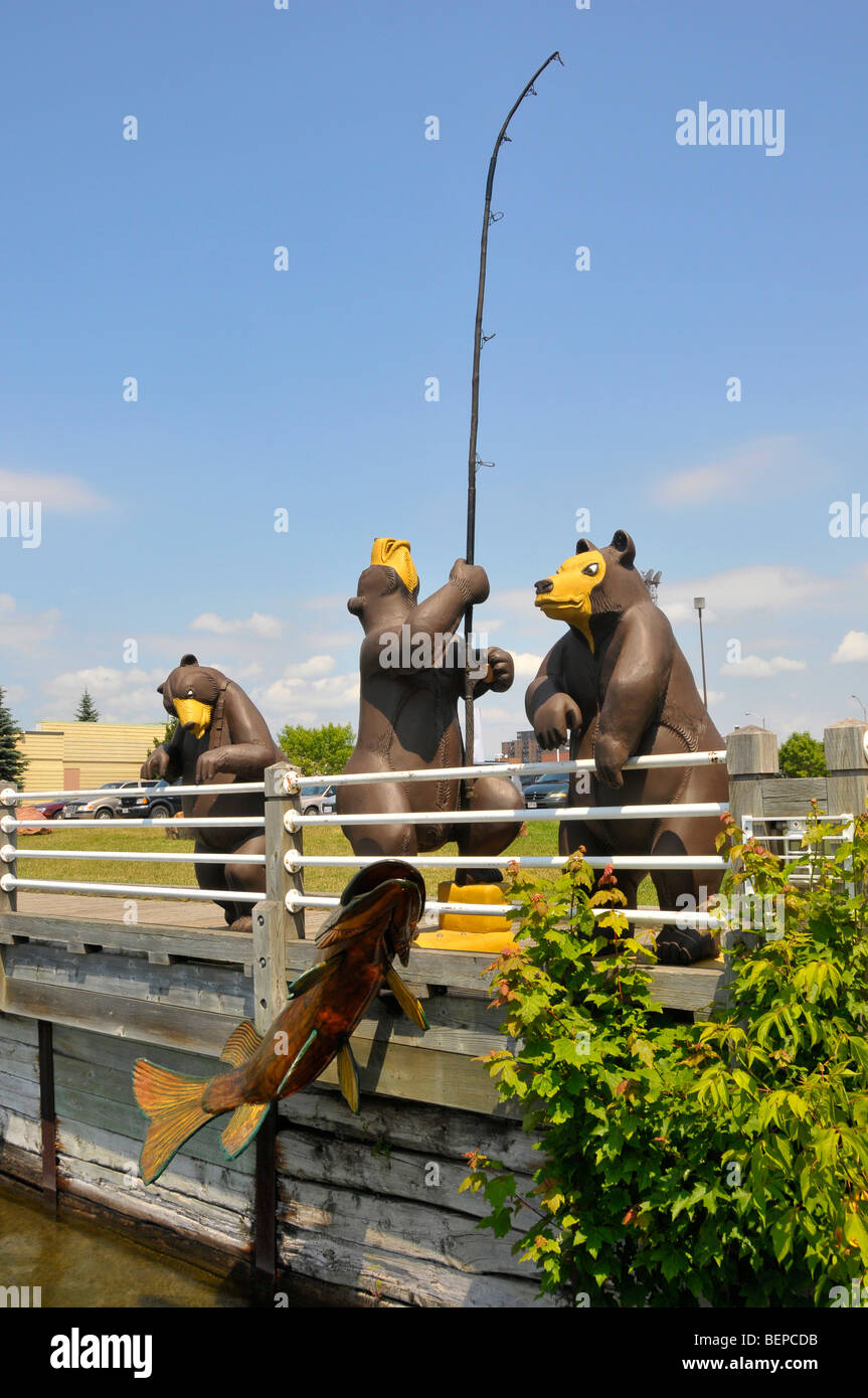 Statue of three bears fishing in Roberta Bondar Park along St. Mary's ...