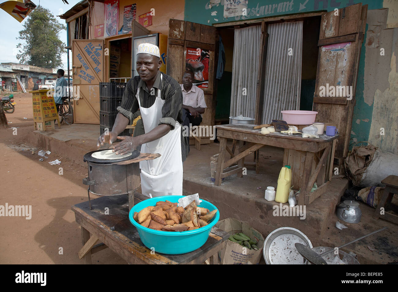 UGANDA Man making chapattis, Nakifuma village, Mukono District. PHOTO ...