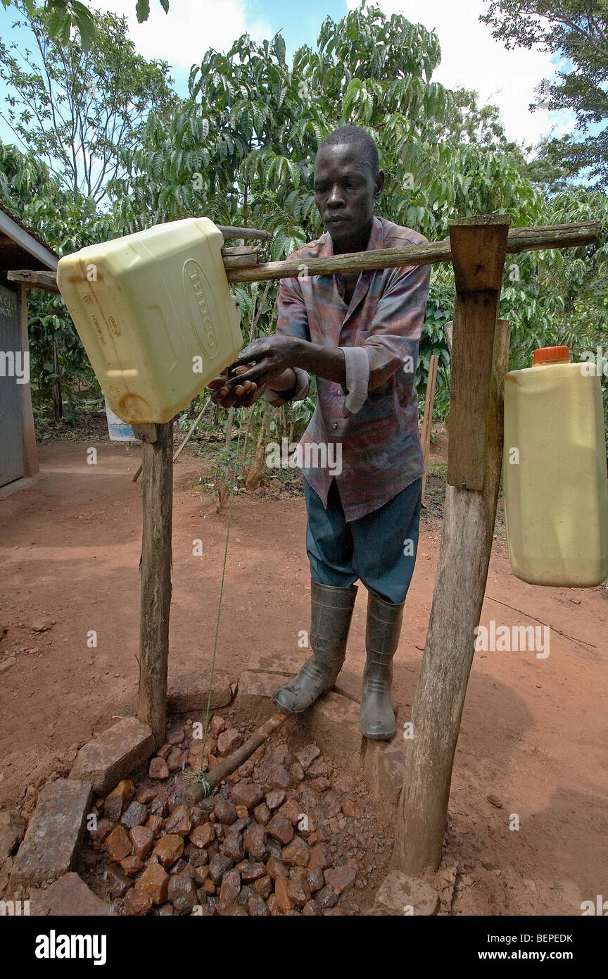 UGANDA Man washing his hands Stock Photo - Alamy