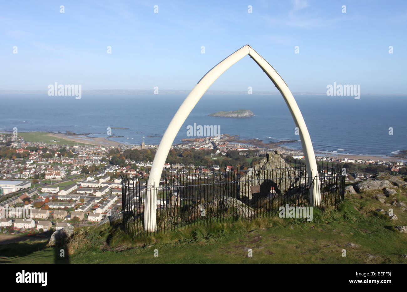 Replica whale jaw bone at summit of North Berwick Law with view of town ...