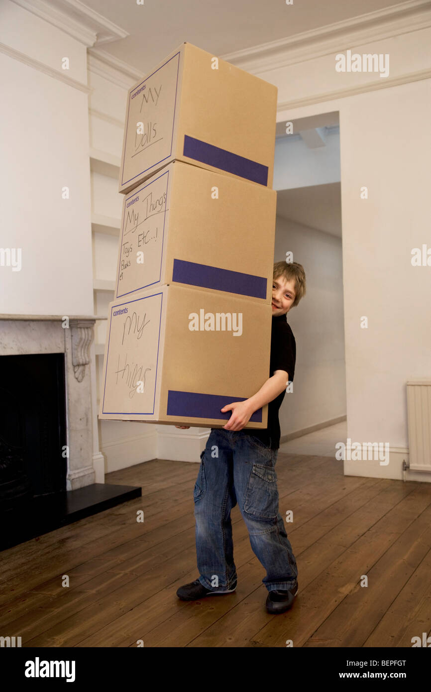 Child lifting a box hi-res stock photography and images - Alamy