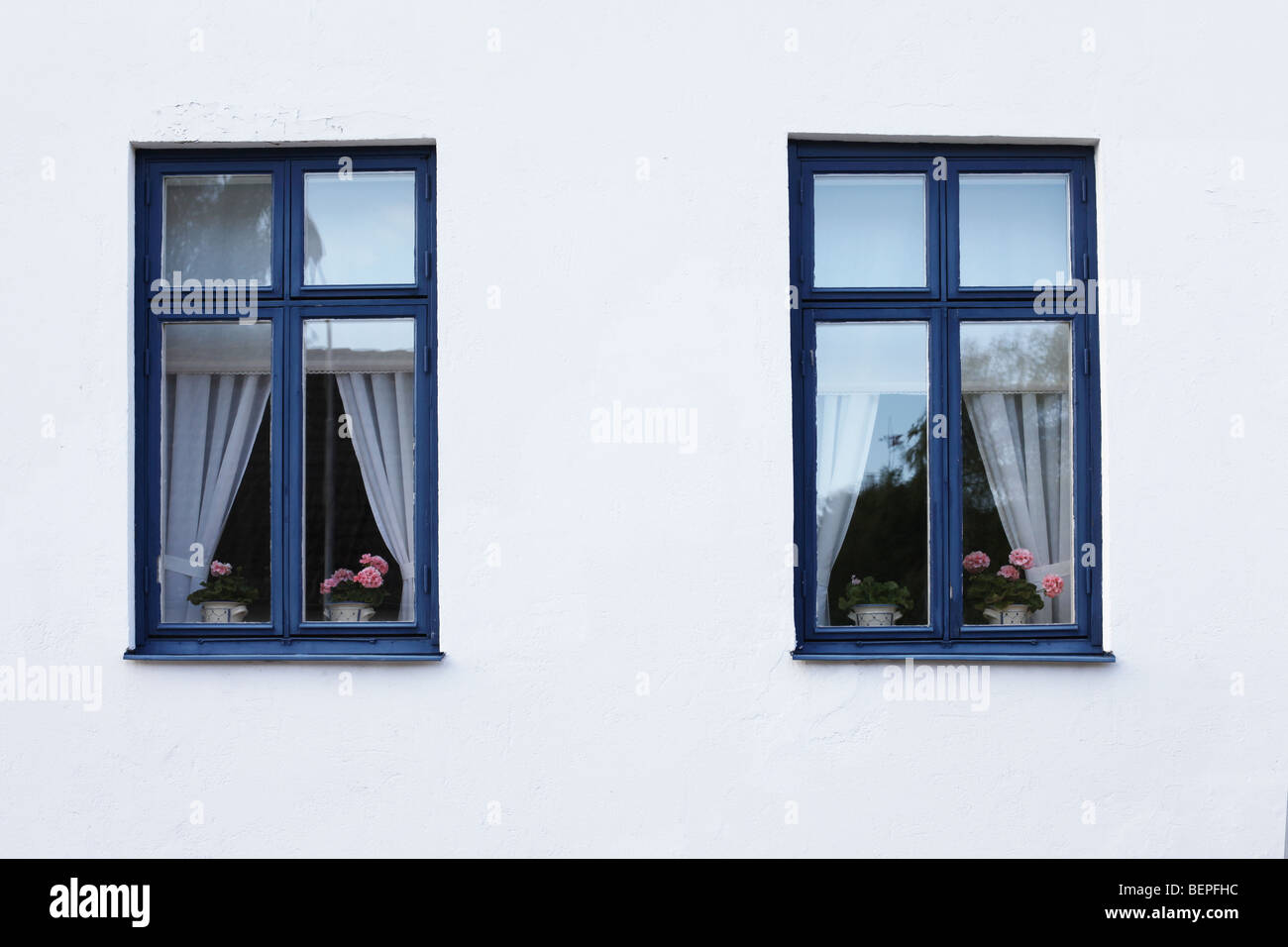 Two identical windows Stock Photo - Alamy
