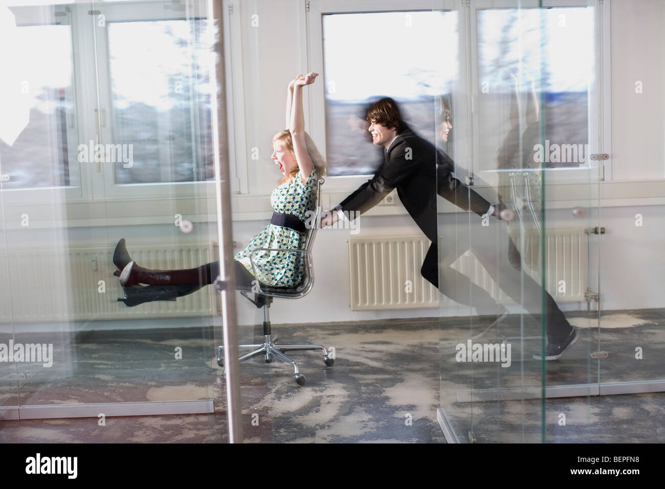 office chair race Stock Photo - Alamy