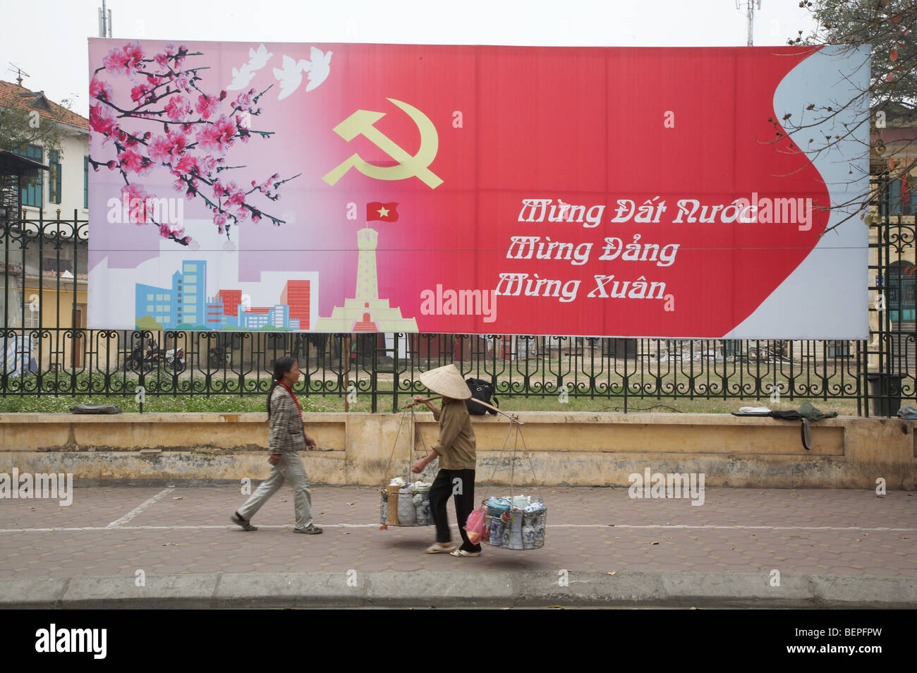 VIETNAM Street scenes, Hanoi. Communist billboard with hammer and ...