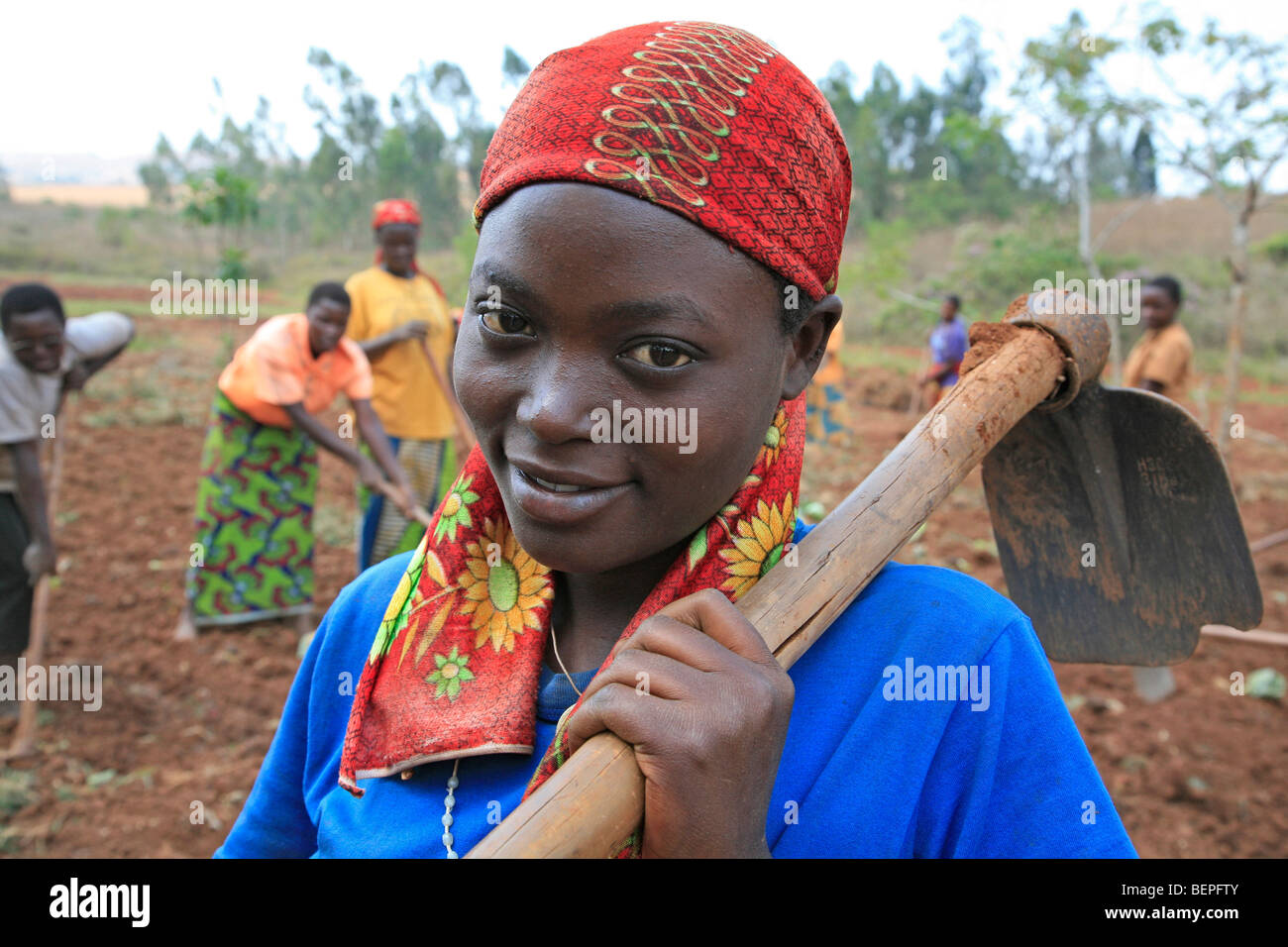 BURUNDI Woman carrying a hoe, Gitera. PHOTOGRAPH by Sean Sprague 2009 ...