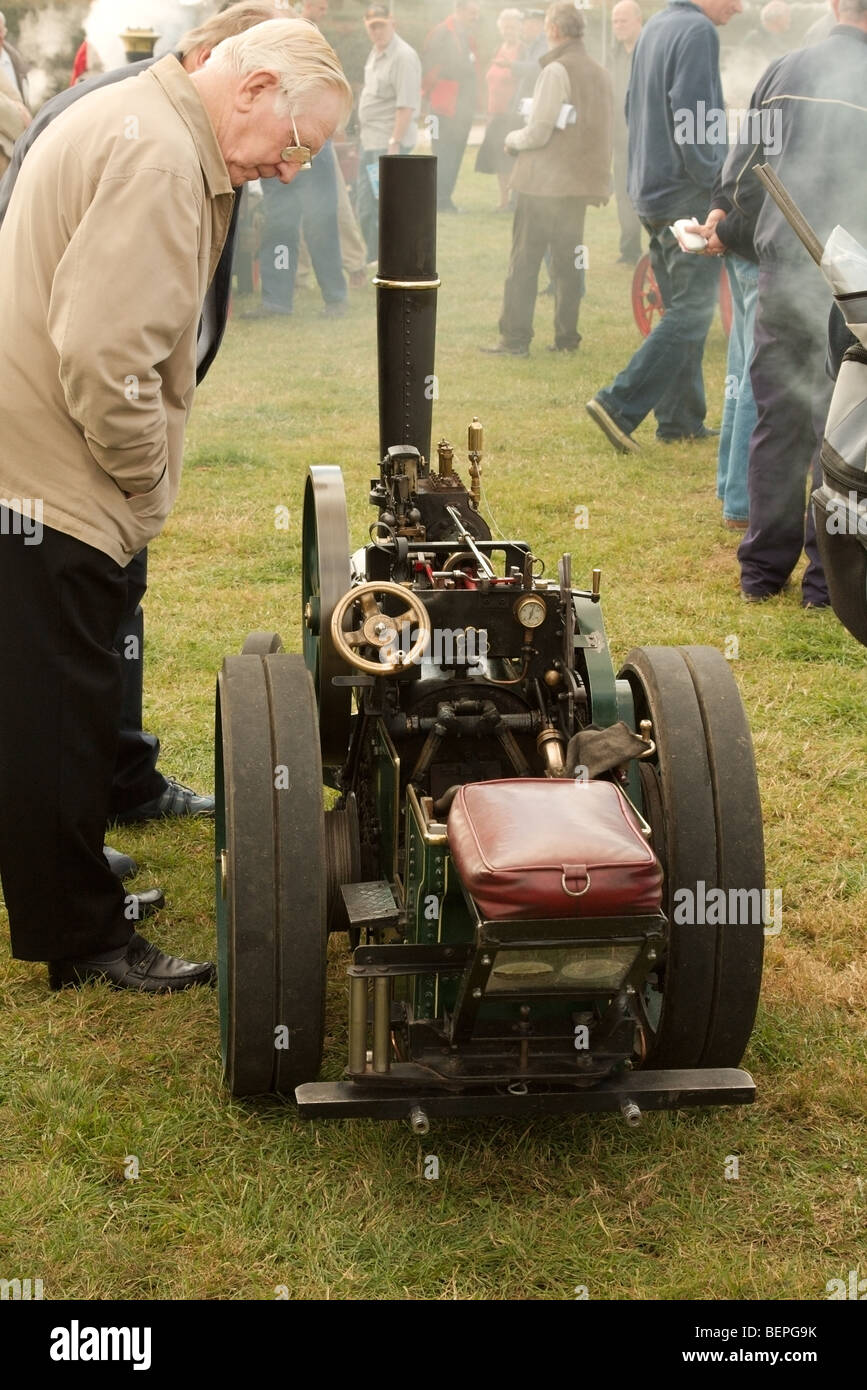 an enthusiast admires a scale model traction engine Stock Photo - Alamy
