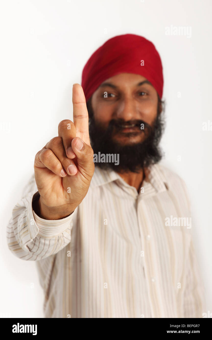 Front view of man with 1 Malaysia hand gesture Stock Photo - Alamy