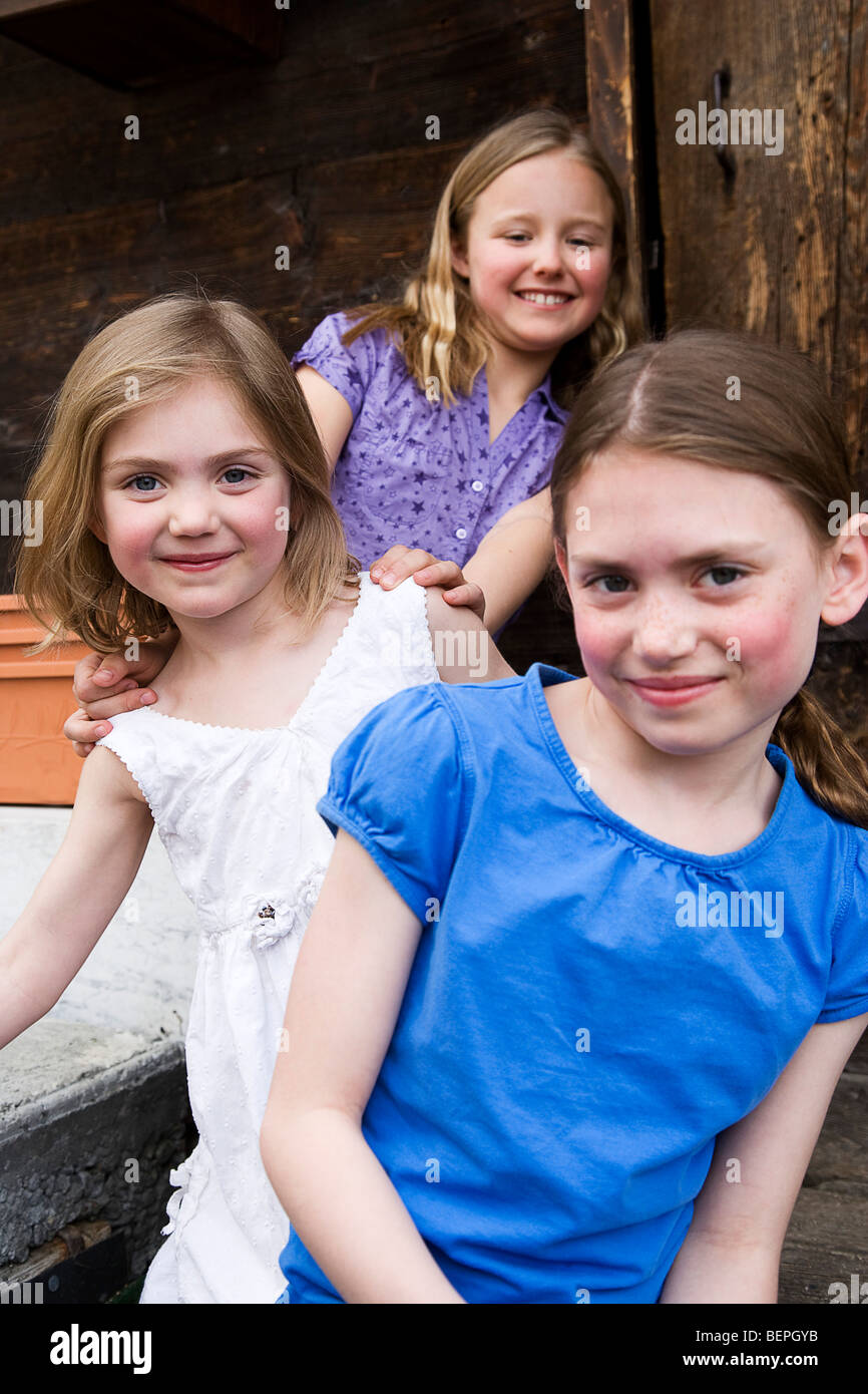 Three girls smiling Stock Photo - Alamy