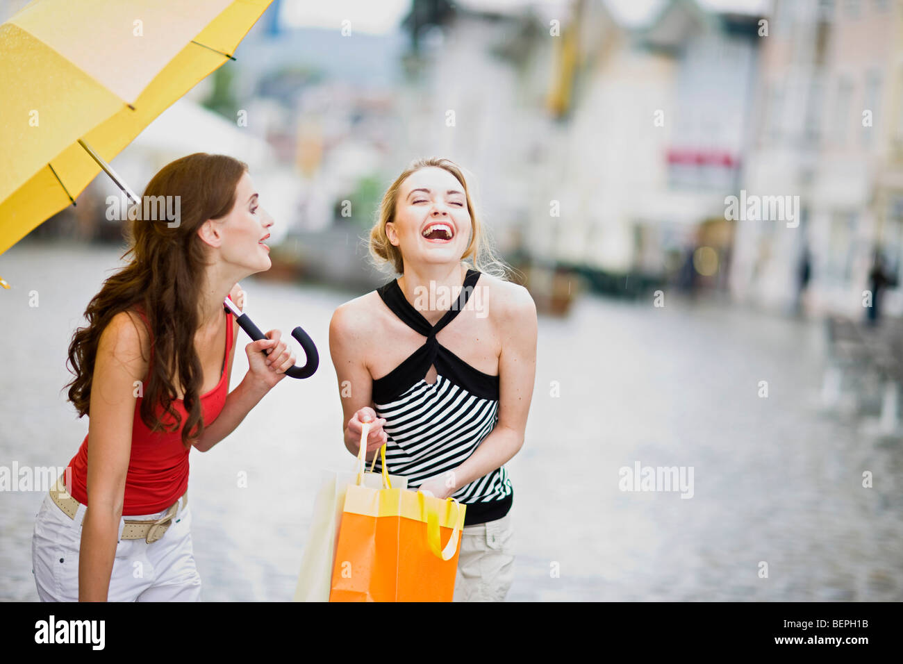 girls having fun in the rain Stock Photo - Alamy