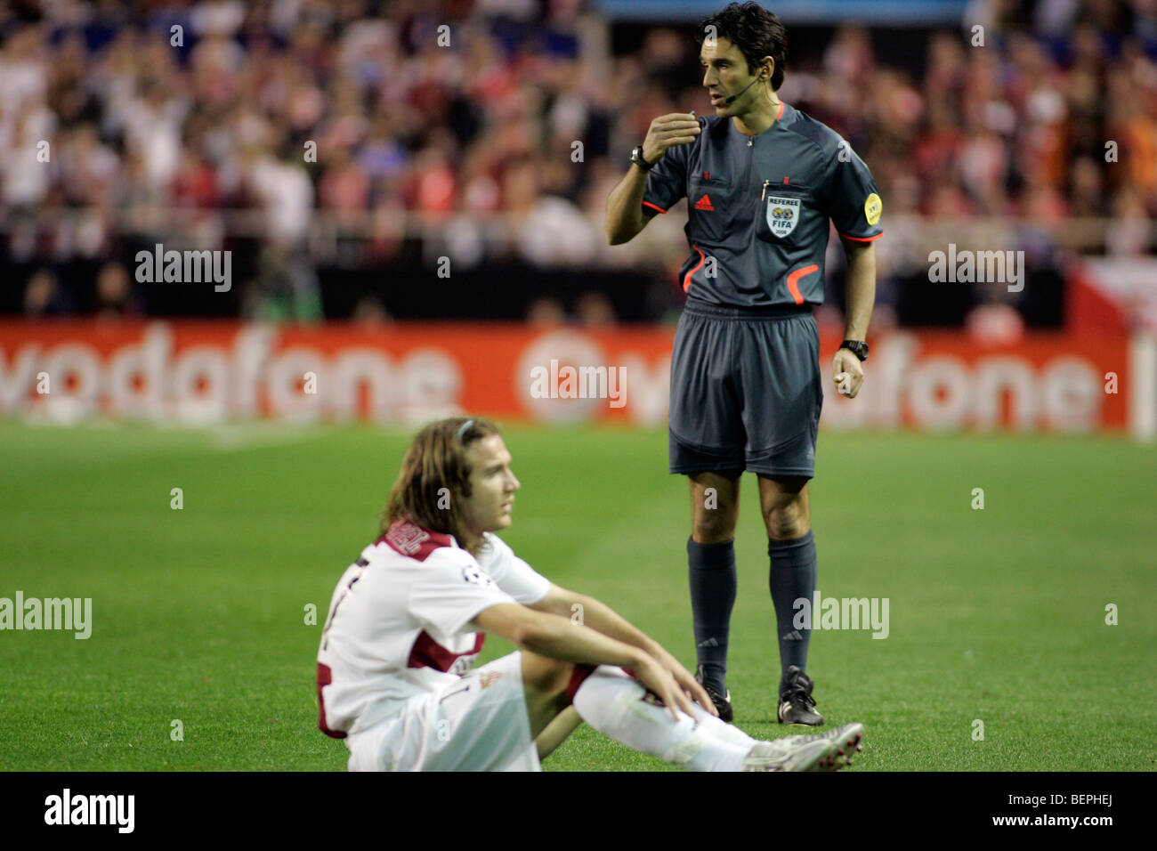 The Swiss referee Massimo Busacca and Diego Capel (Sevilla Stock Photo ...