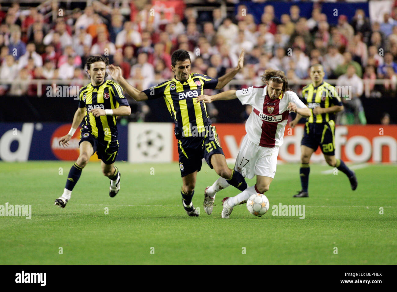 Selyuk Şahin (Fenerbahce) committing foul on Diego Capel (Sevilla Stock ...