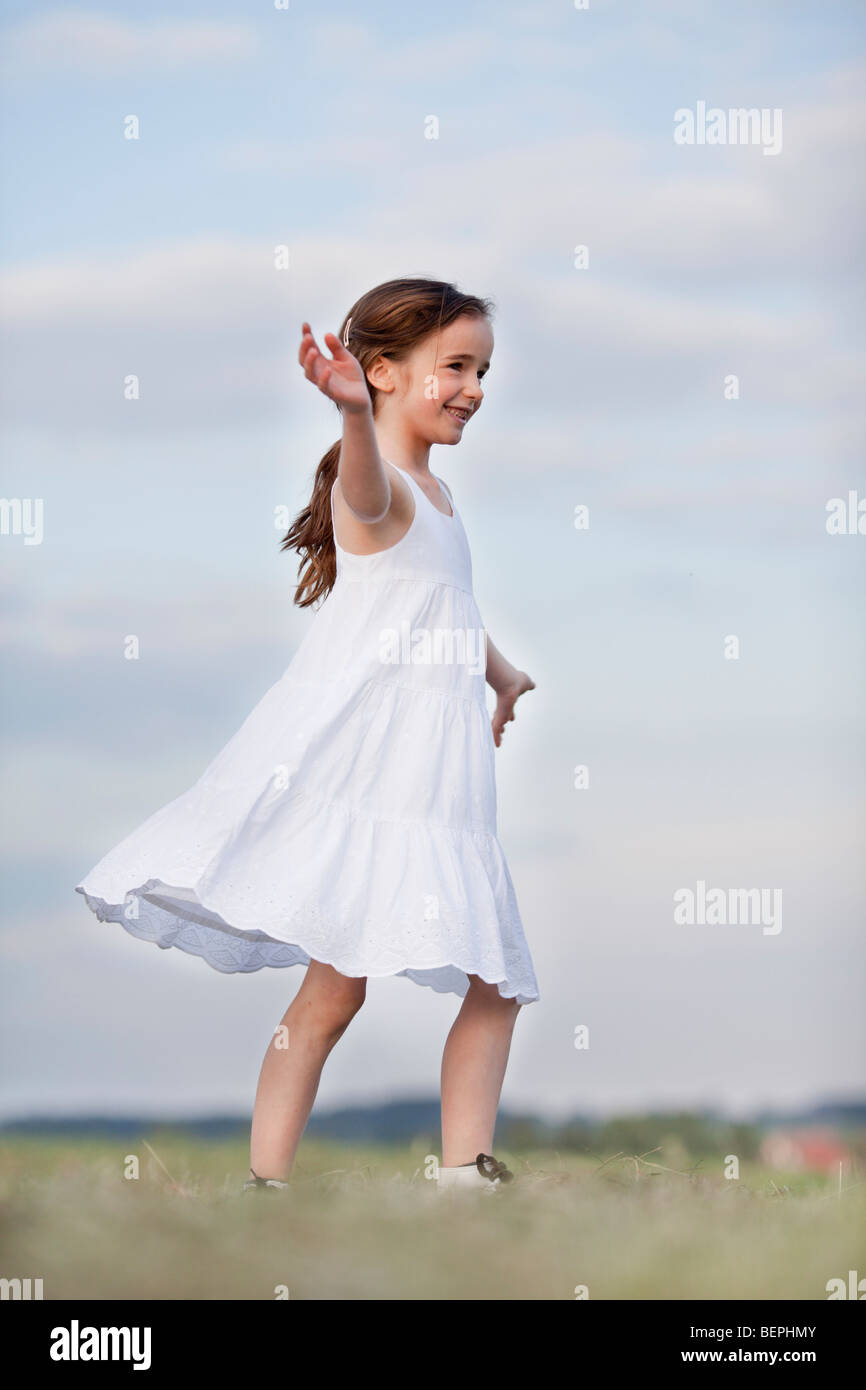 young girl dancing in the grass Stock Photo - Alamy