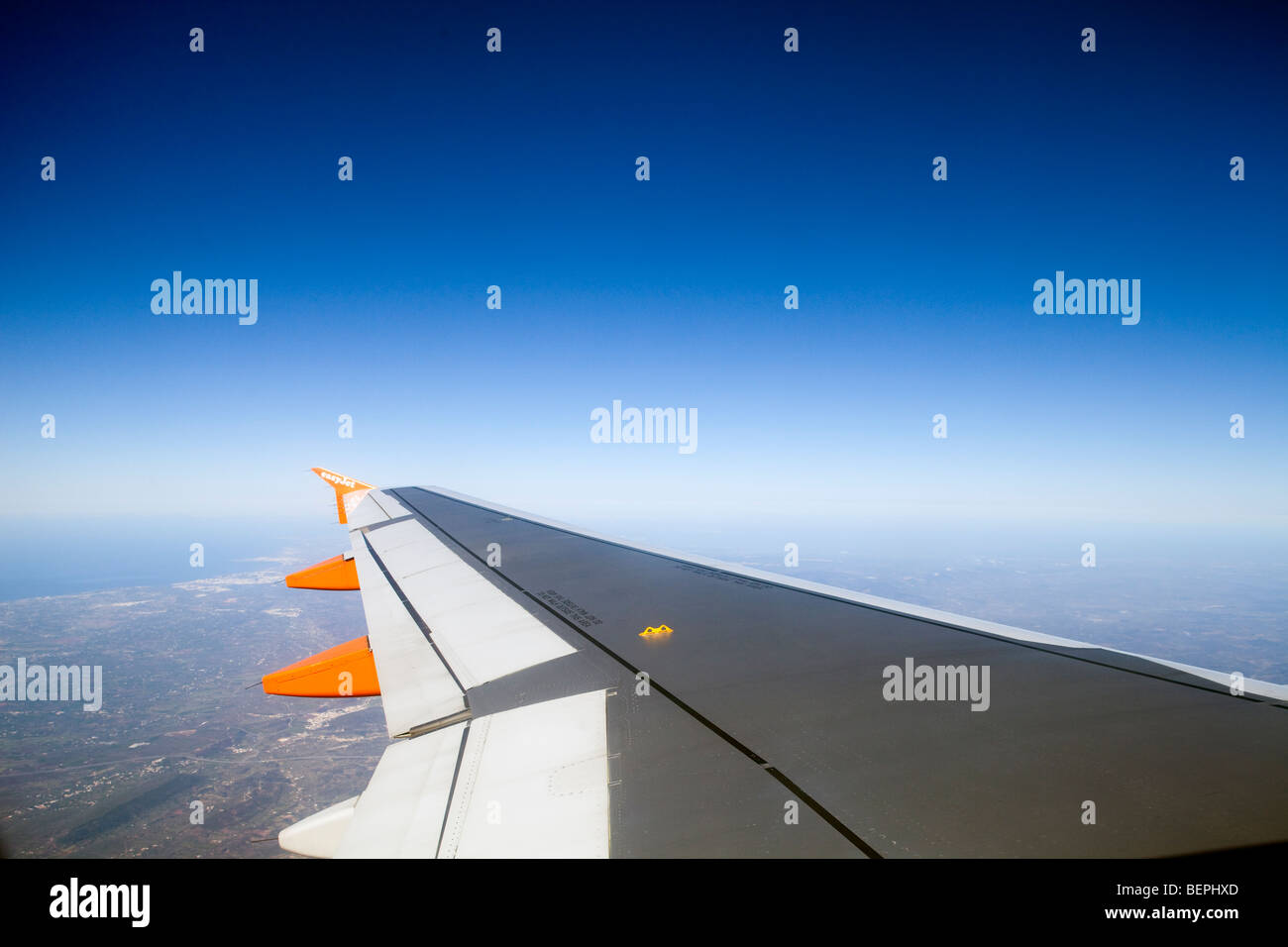 Wing of an airplane belonging to EasyJet flying over Portugal Stock ...