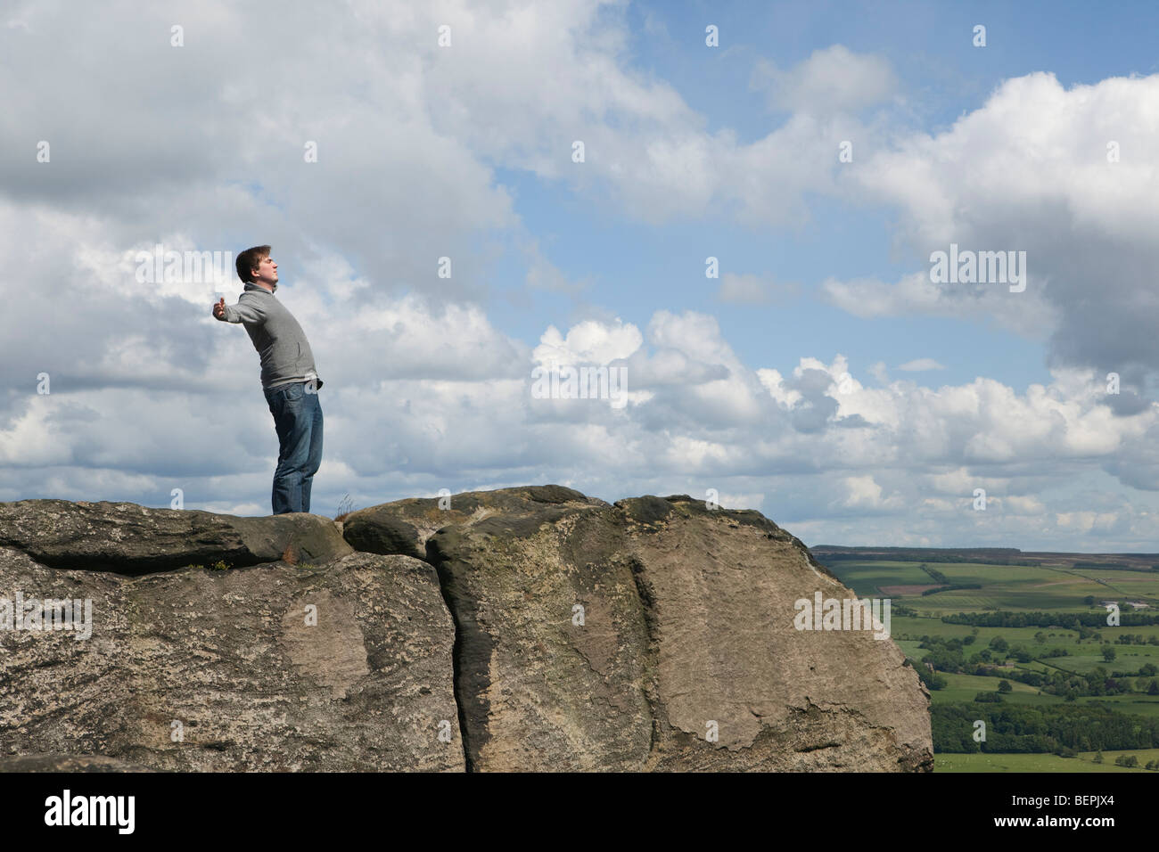 Man standing in wind Stock Photo - Alamy