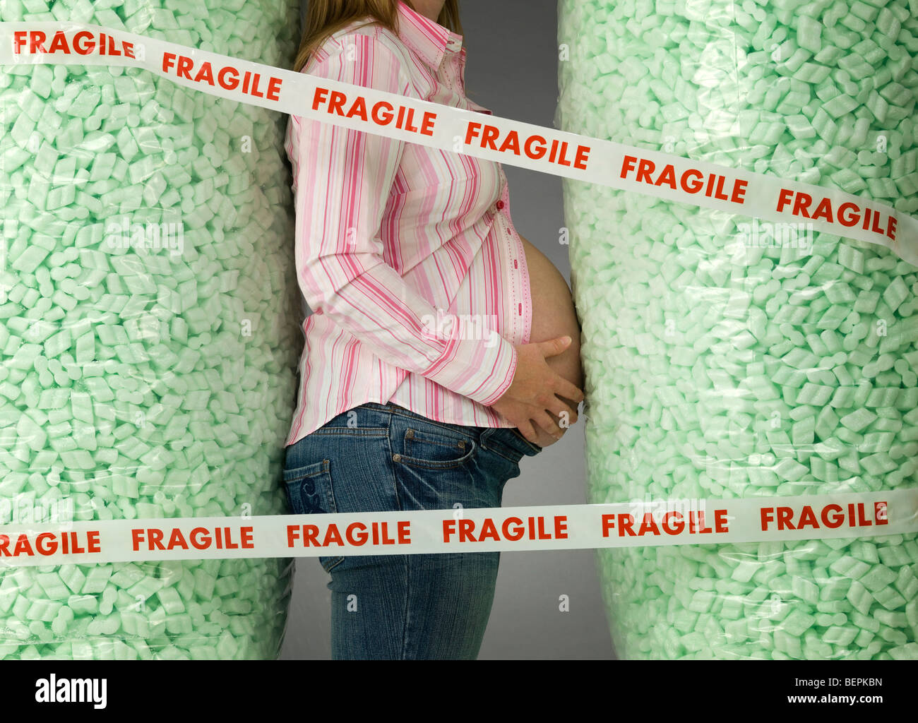 pregnant woman in protective packaging Stock Photo - Alamy