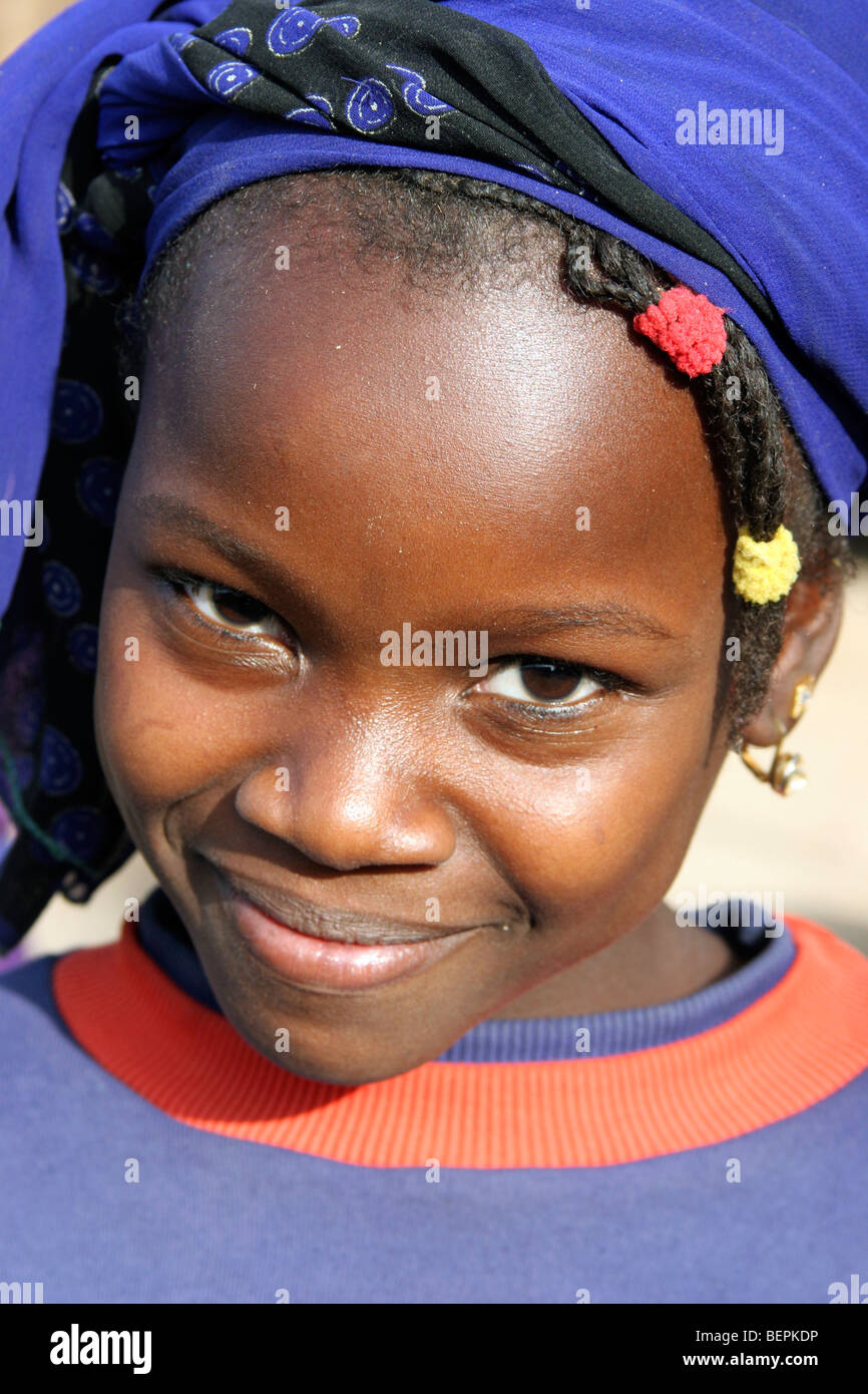 Close up portrait of smiling black African child in Niger, Western ...