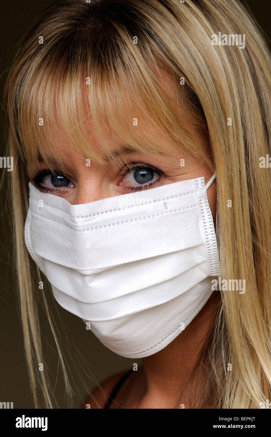 Portrait of a woman wearing a medical face mask Stock Photo - Alamy
