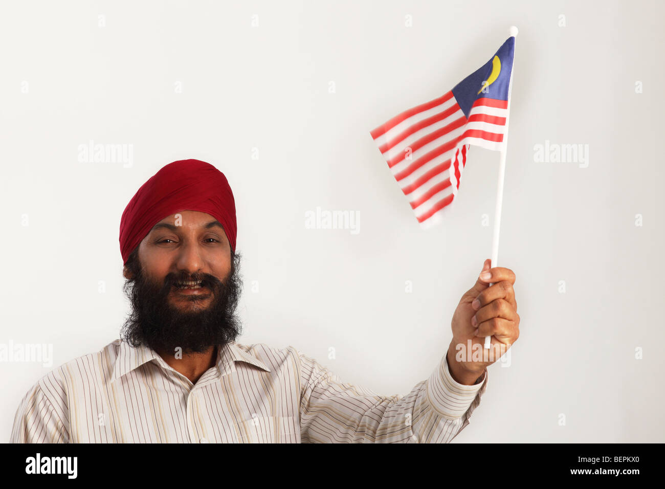 Front view of man with 1 Malaysia hand gesture Stock Photo - Alamy